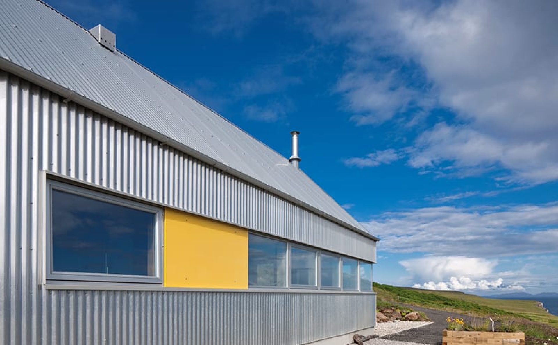 Behind its striking aluminium cladding is a beautifully simple house ...